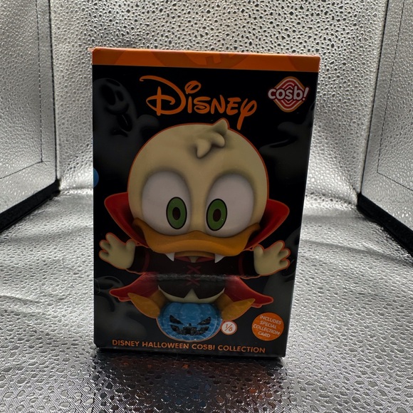 Disney | Accessories | Disney Cosbi Vampire Duck Figure Orange And ...